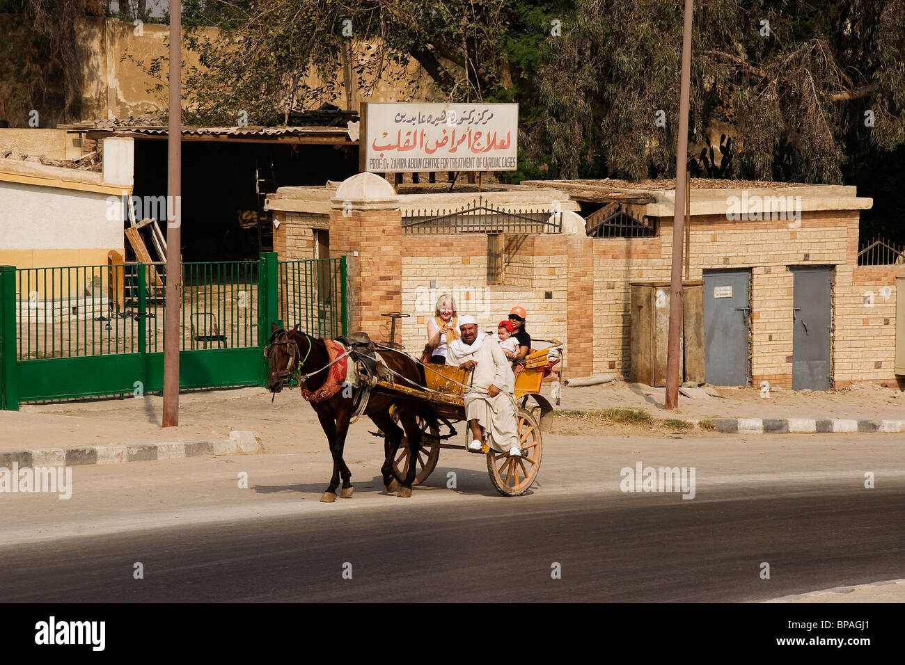 Arab with horse and carriage giving tourists a lift up the hill to the ...