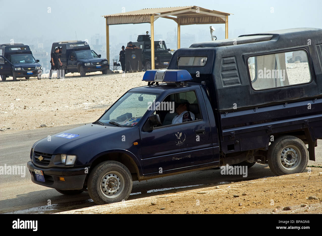Egyptian police at the entrance to the Giza pyramids line up in their ...