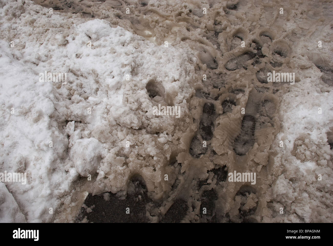 footprints in dirty slushy snow at street crosswalk Stock Photo - Alamy