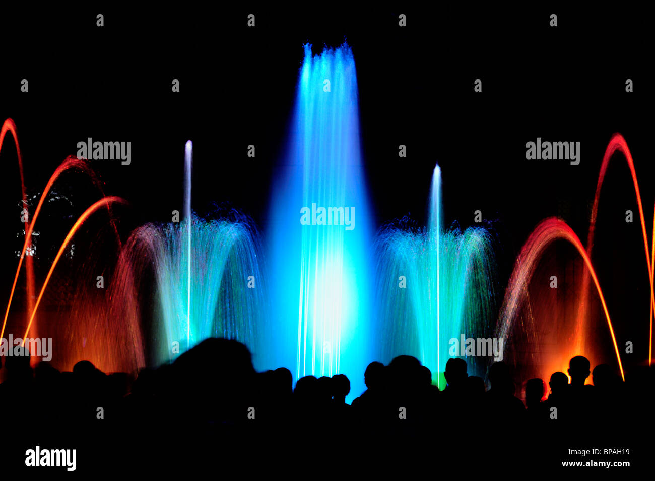 people looking at the night lighting water show Stock Photo - Alamy