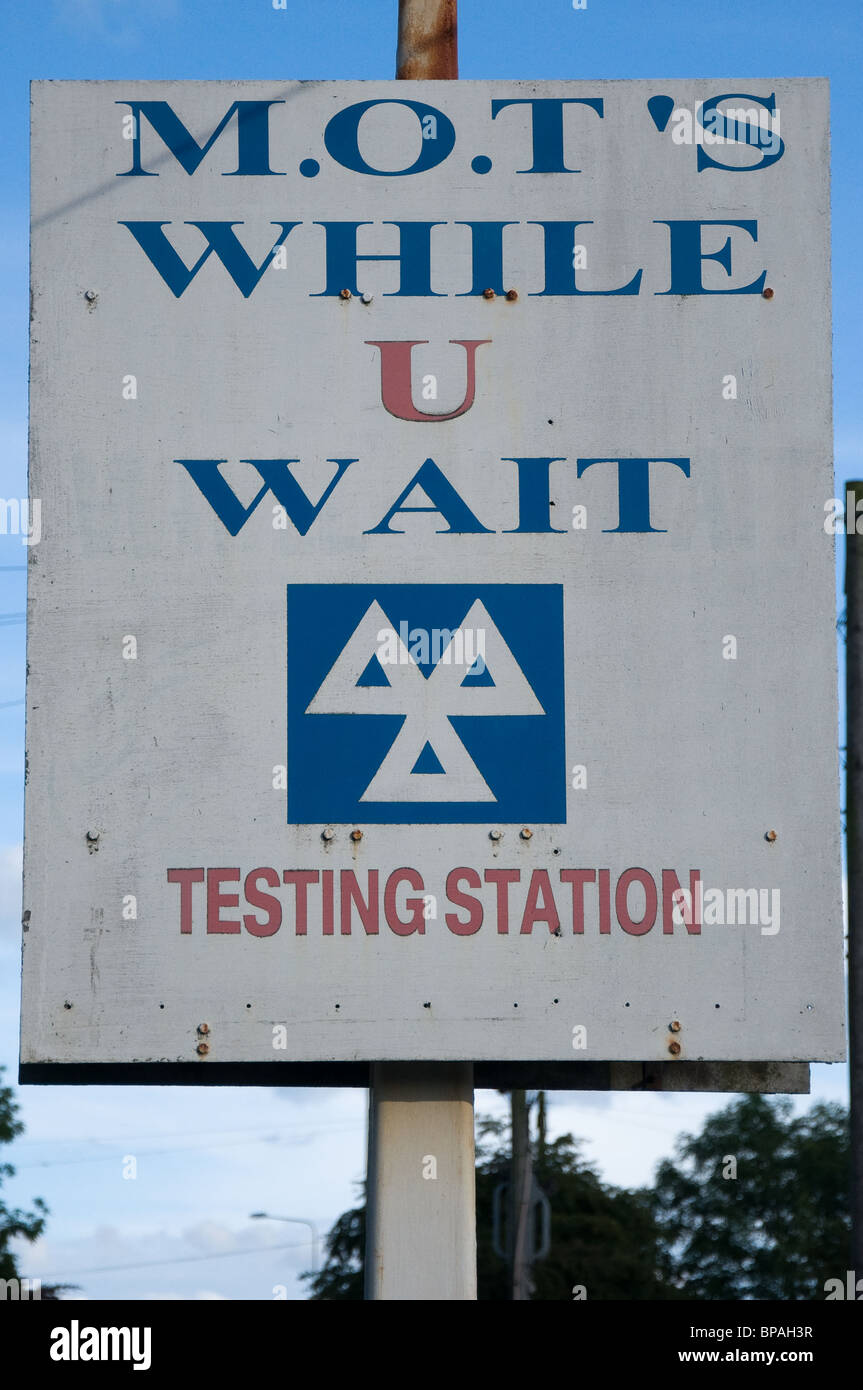M.O.T. While you wait sign Stock Photo - Alamy