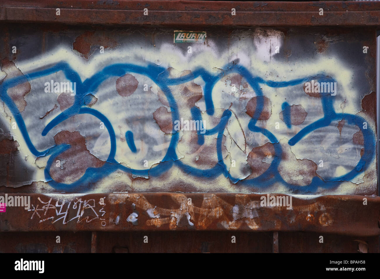 Graffiti on rusted surface Stock Photo - Alamy