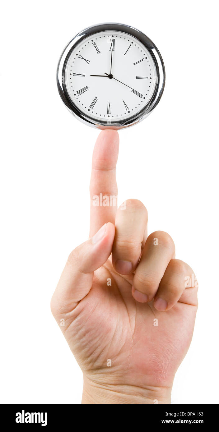 Clock face and finger, concept of Time Balance Stock Photo - Alamy