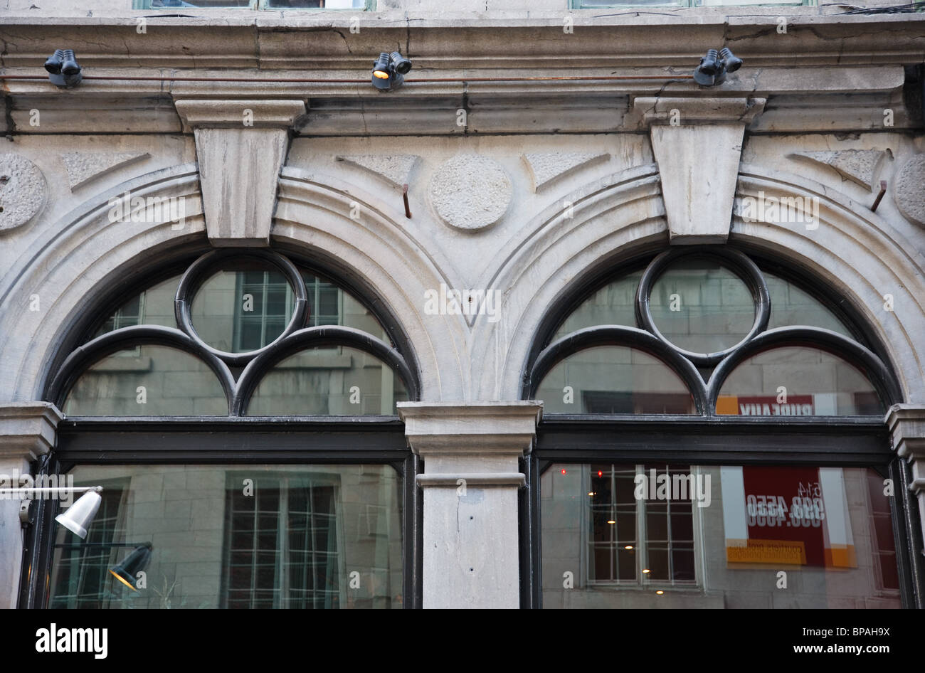 Arch and windows of building exterior Stock Photo - Alamy
