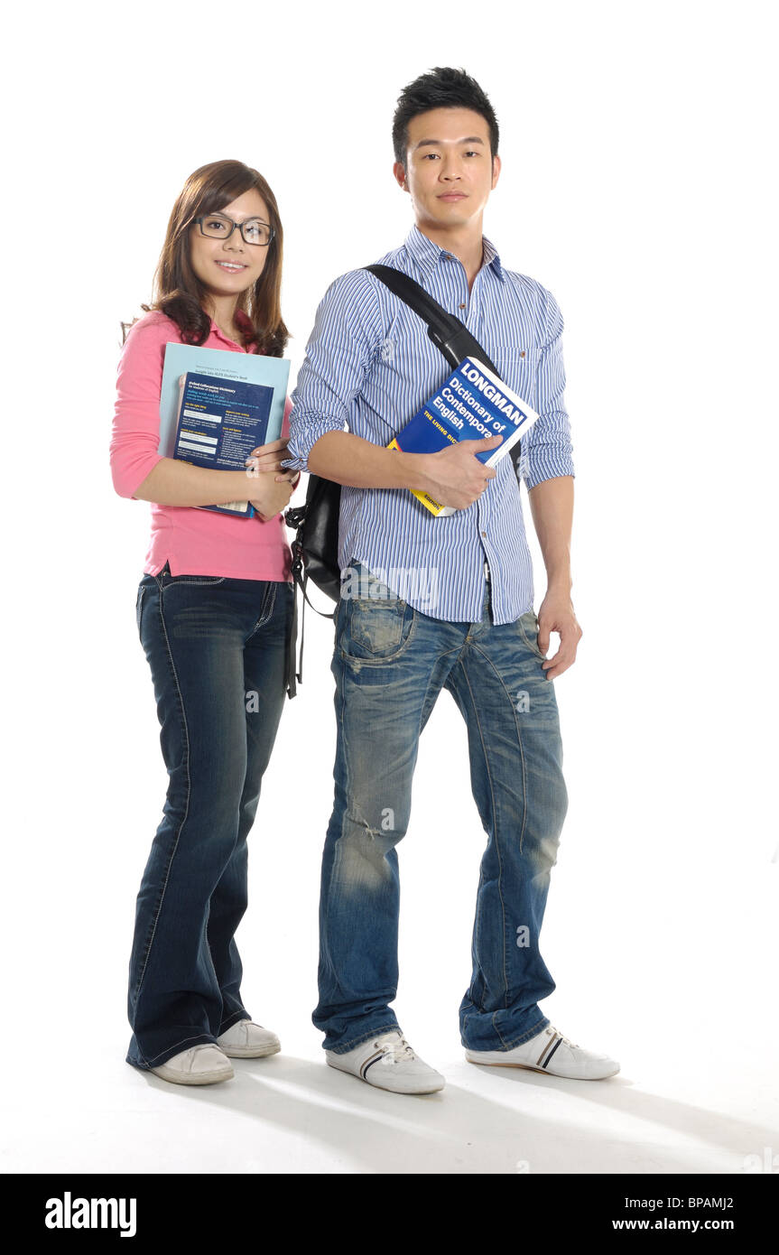 University students standing together with books Stock Photo - Alamy