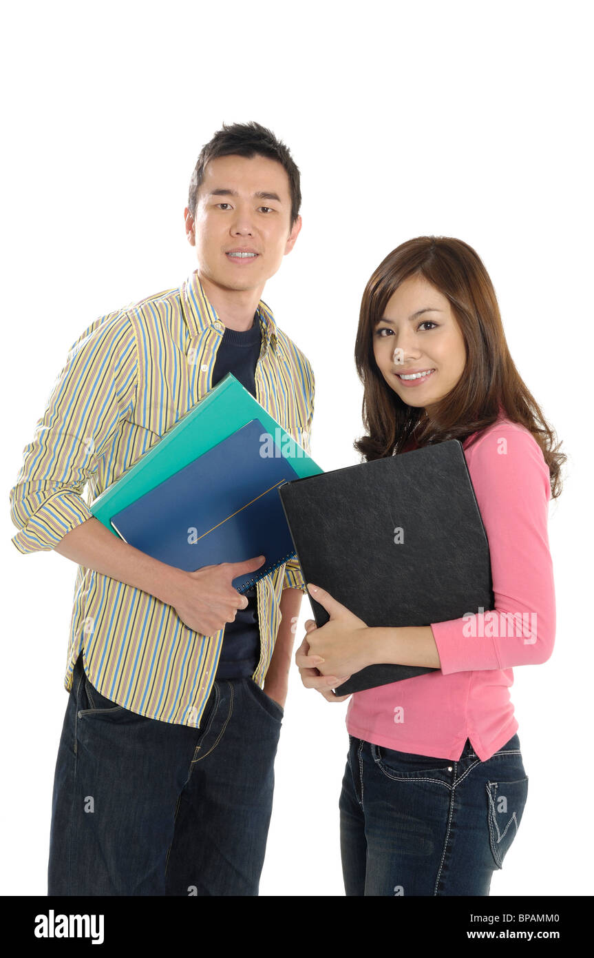 University students holding books and smiling Stock Photo - Alamy