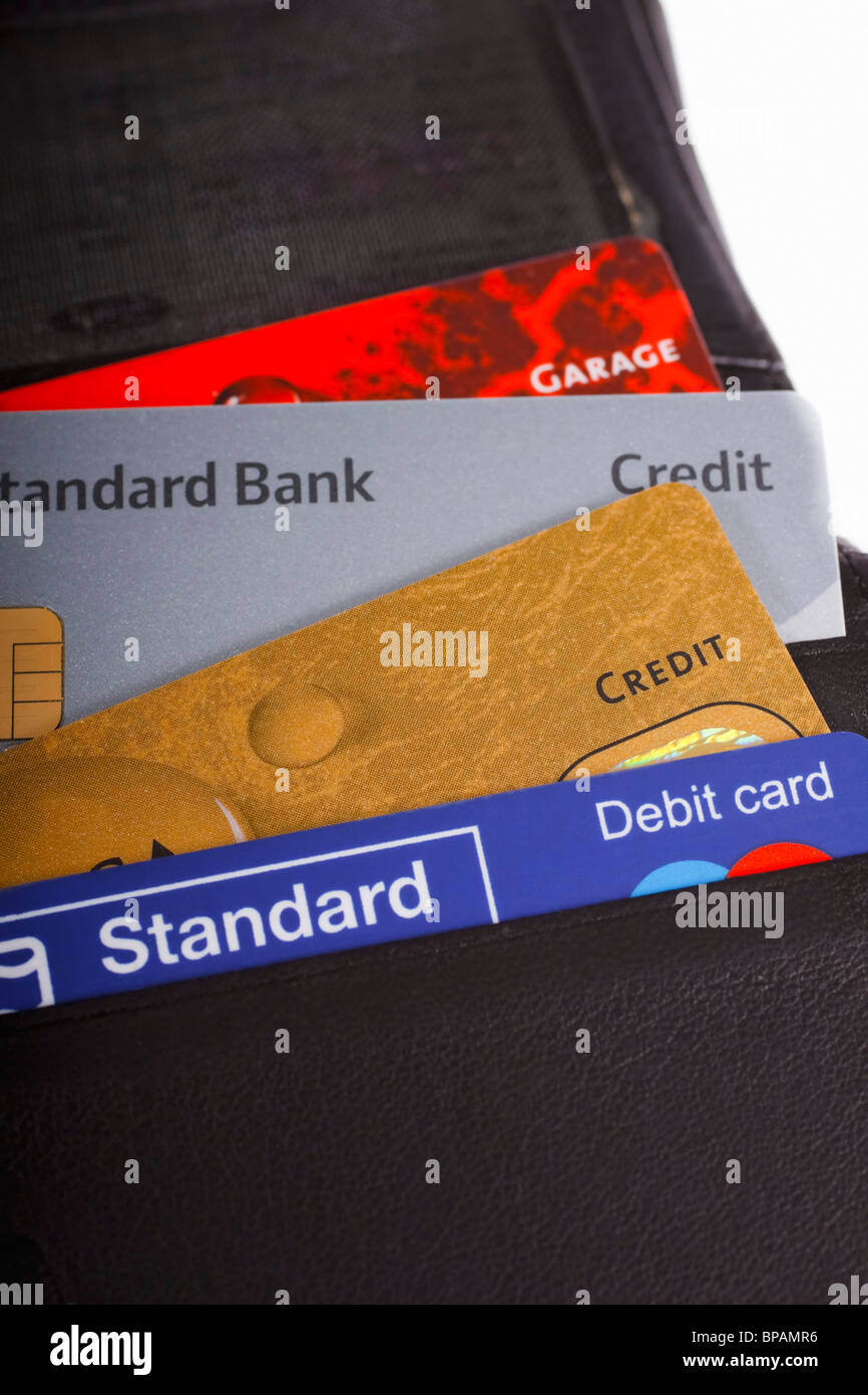 Credit and debit cards in a wallet Stock Photo - Alamy