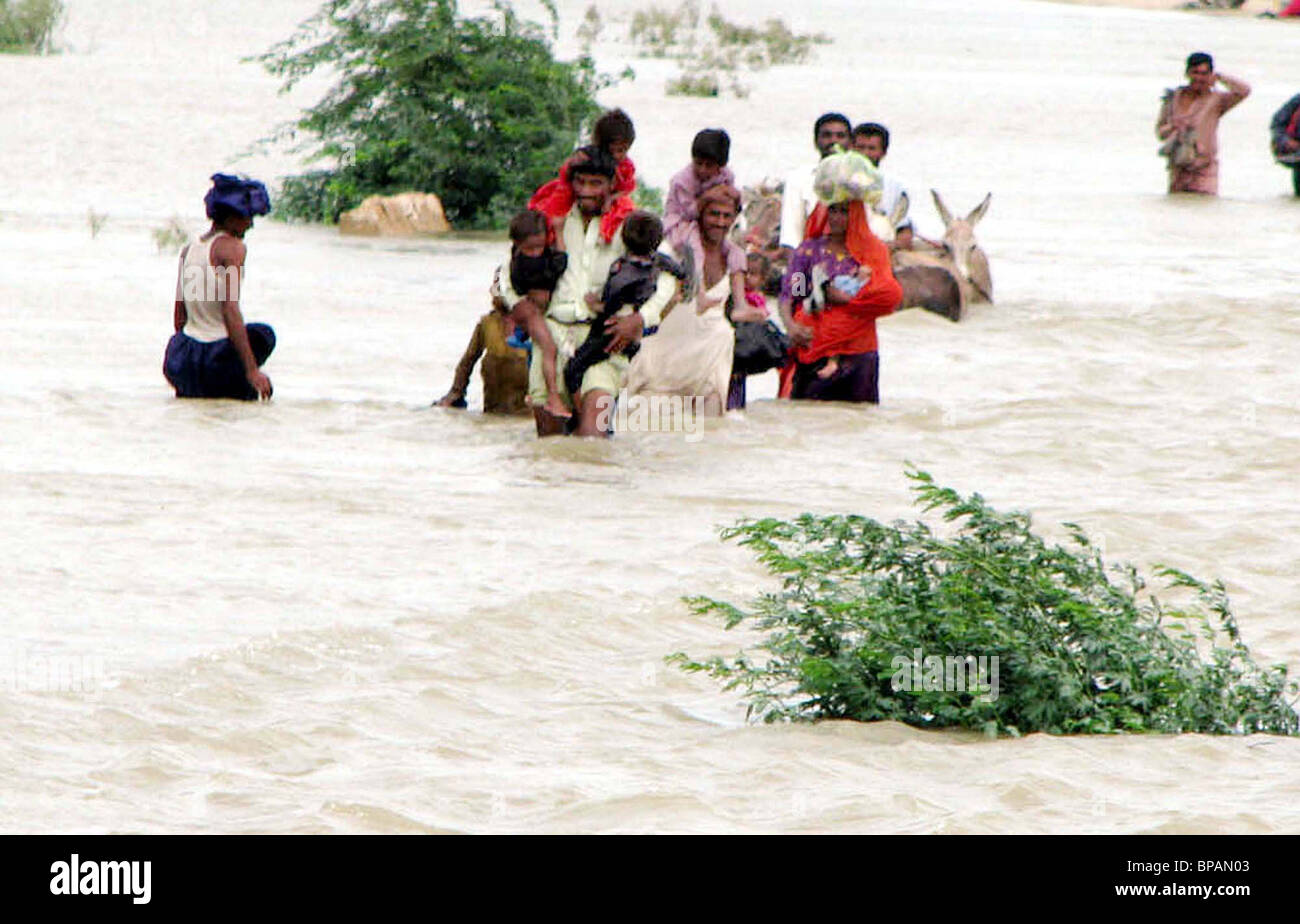 Flood affected people move towards safe place through flooded area ...