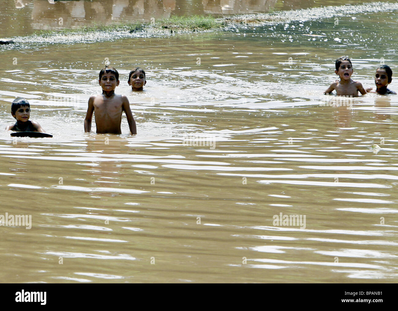 Children enjoy bath at flooded area at a flood hit area at Azakhel in ...