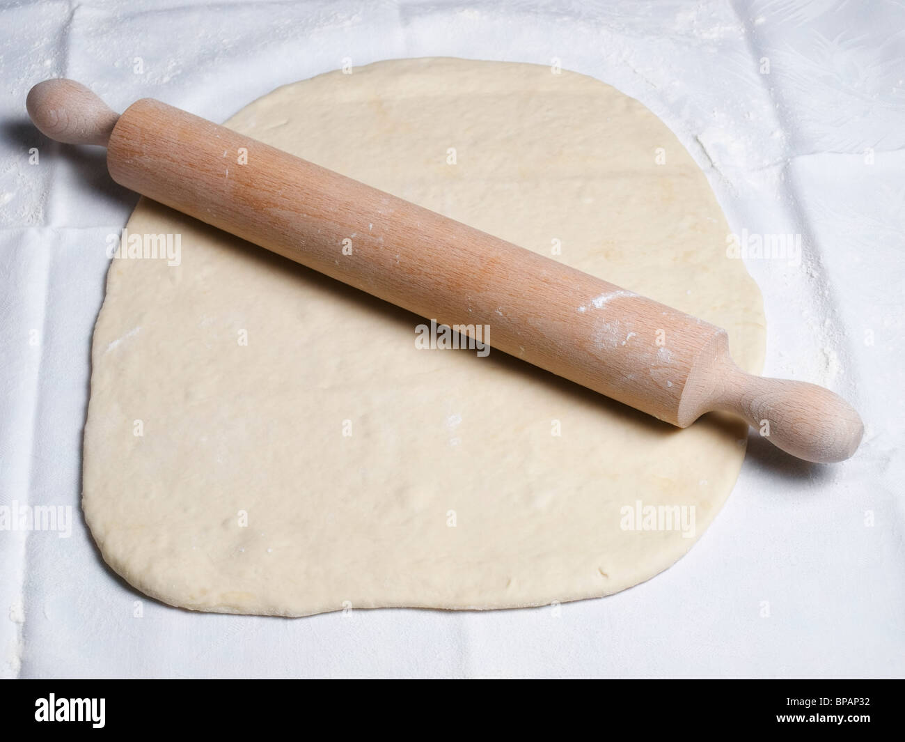 Rolling pin and dough during food preparation Stock Photo - Alamy