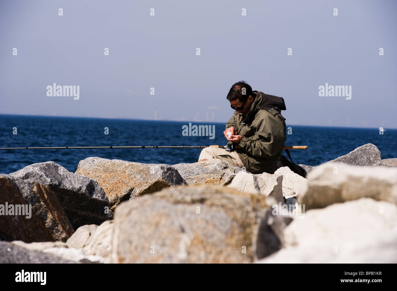 Male man fish fishing rock rocks angling hi-res stock photography and ...