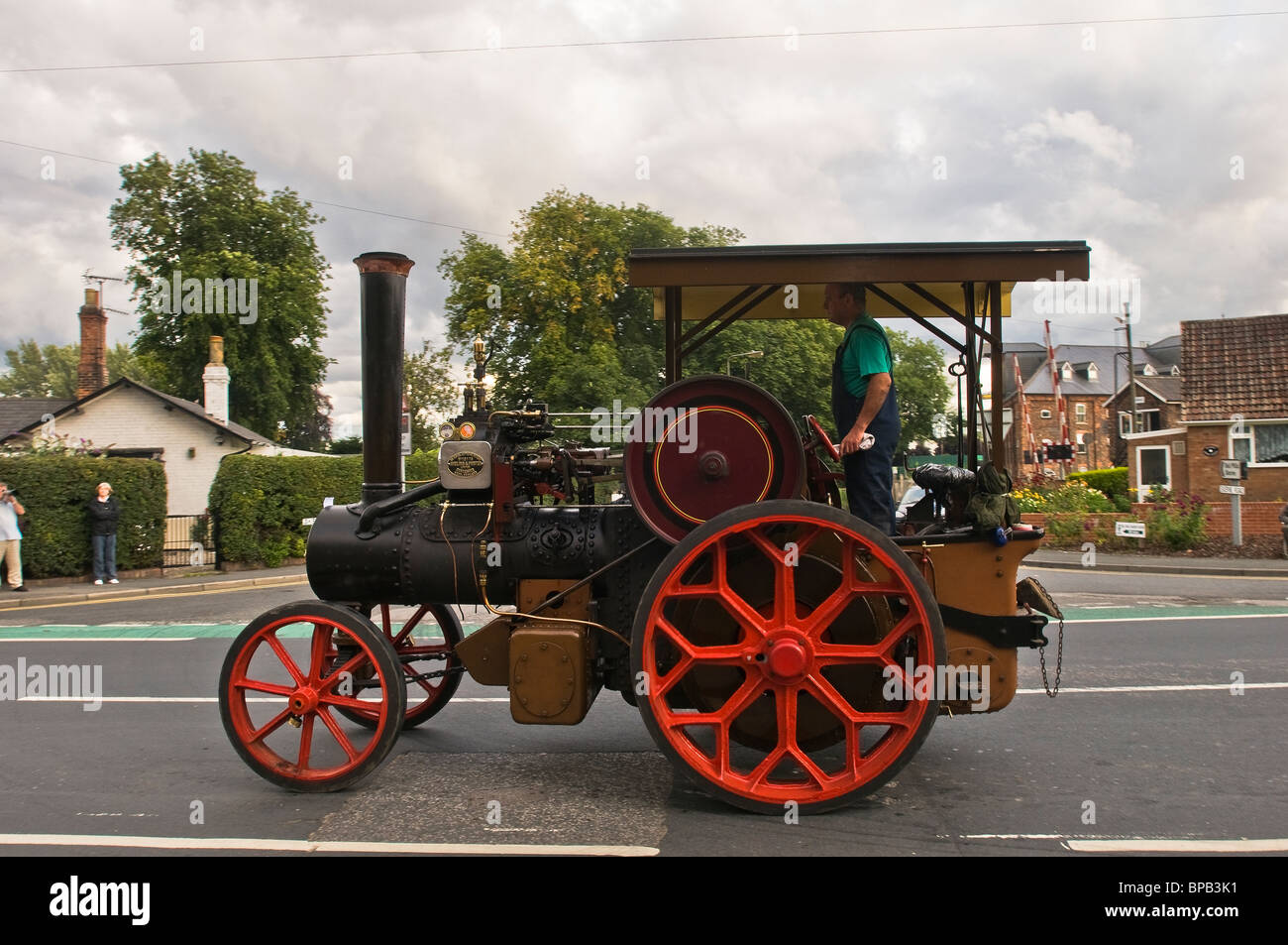 A vintage steam traction engine parades through streets during the 2009 ...