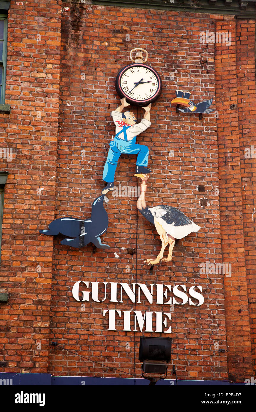 Guinness time advert on wall in Liverpool UK Stock Photo - Alamy