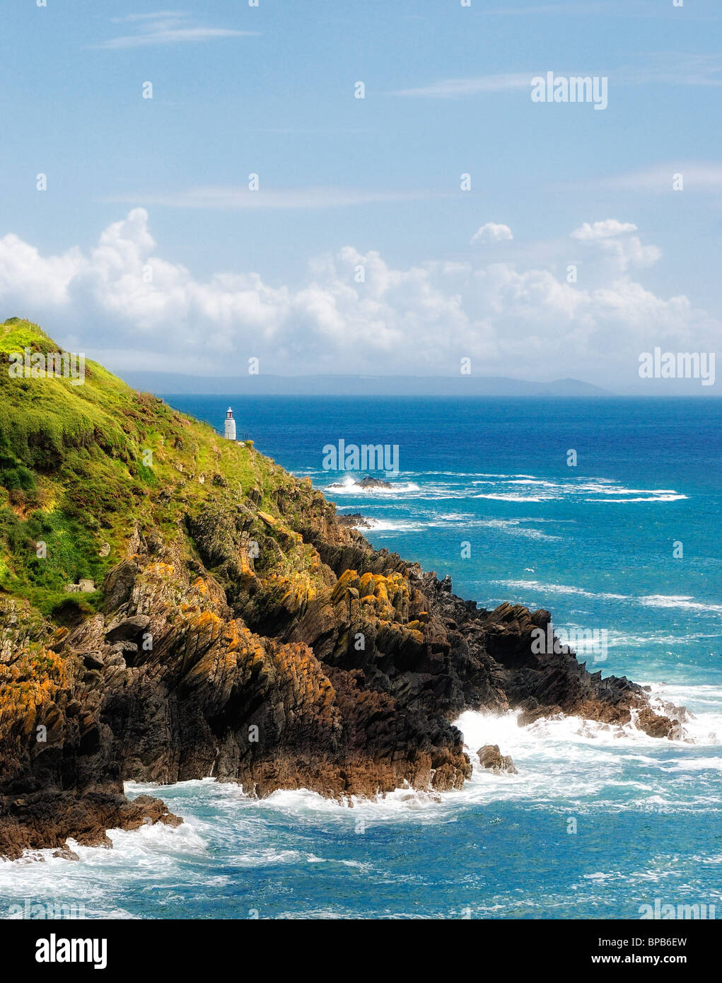 Polperro lighthouse nestled in the rocky cliff cornwall england uk ...