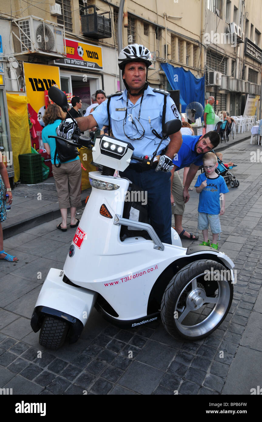 Israel, Haifa, Israeli policeman on a T3 series Electric Stand-up ...