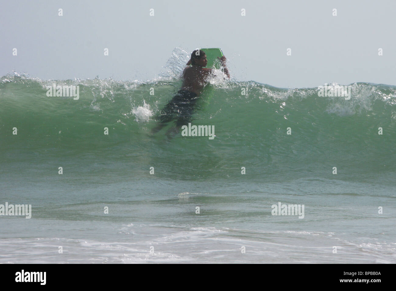 man boogie boarding Stock Photo - Alamy