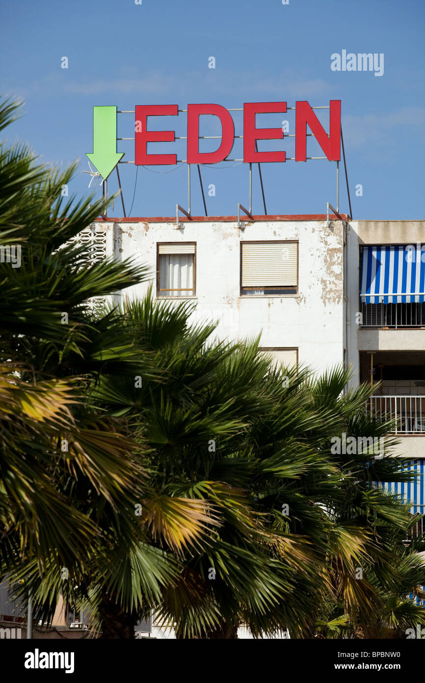 Photograph of apartment building in Spain with "Eden" sign on the roof ...