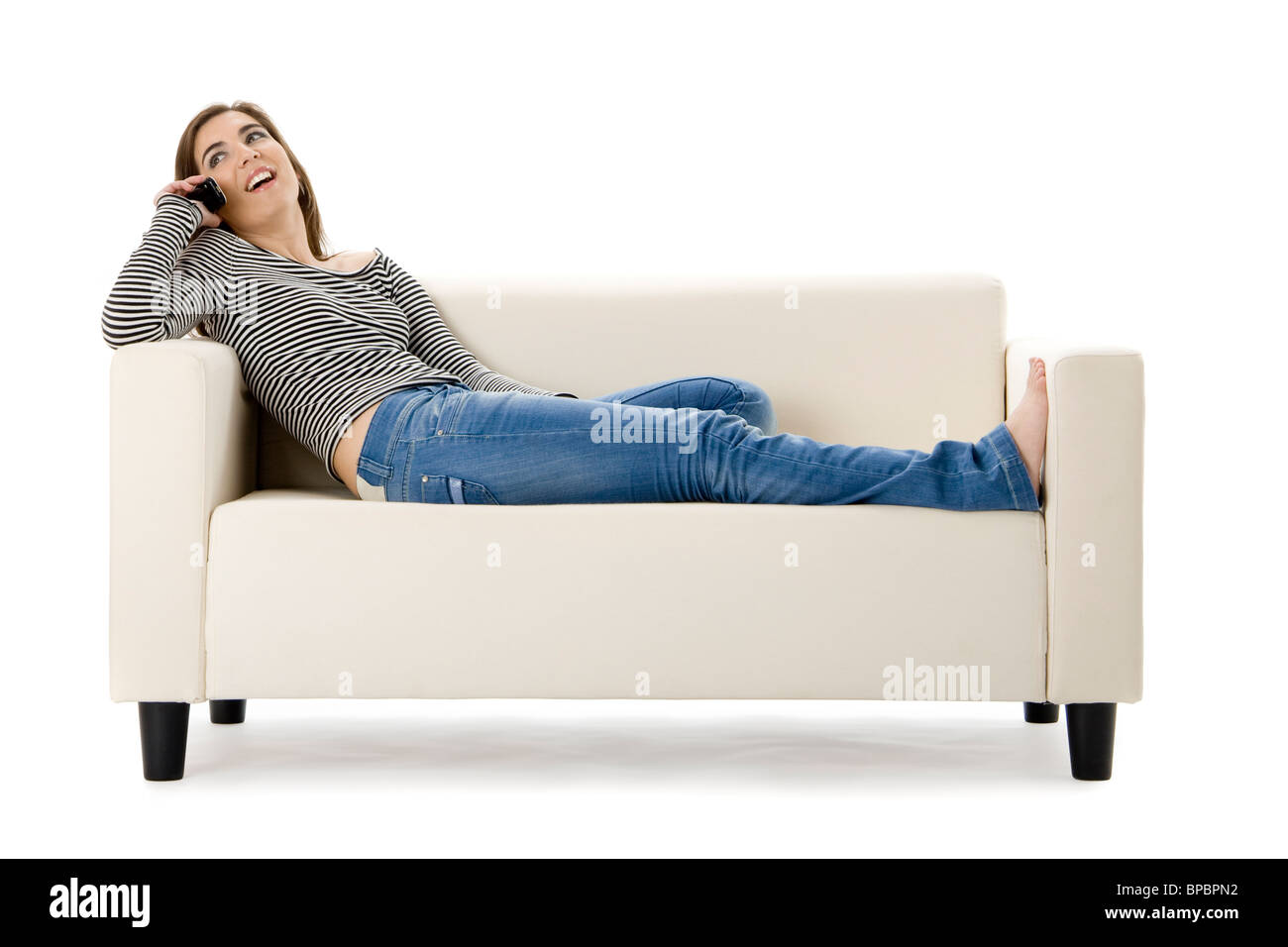 Woman phone sofa Cut Out Stock Images & Pictures - Alamy