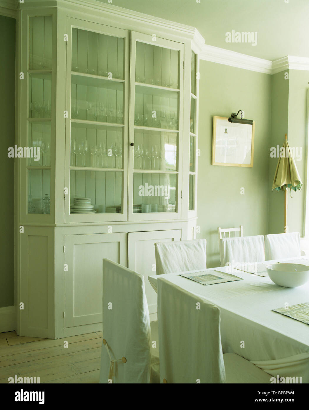 Cream fitted dresser with glazed doors in cream country dining room ...