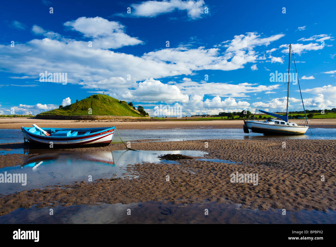 England, Northumberland, Alnmouth. Boats on the tidal Aln Estuary at ...