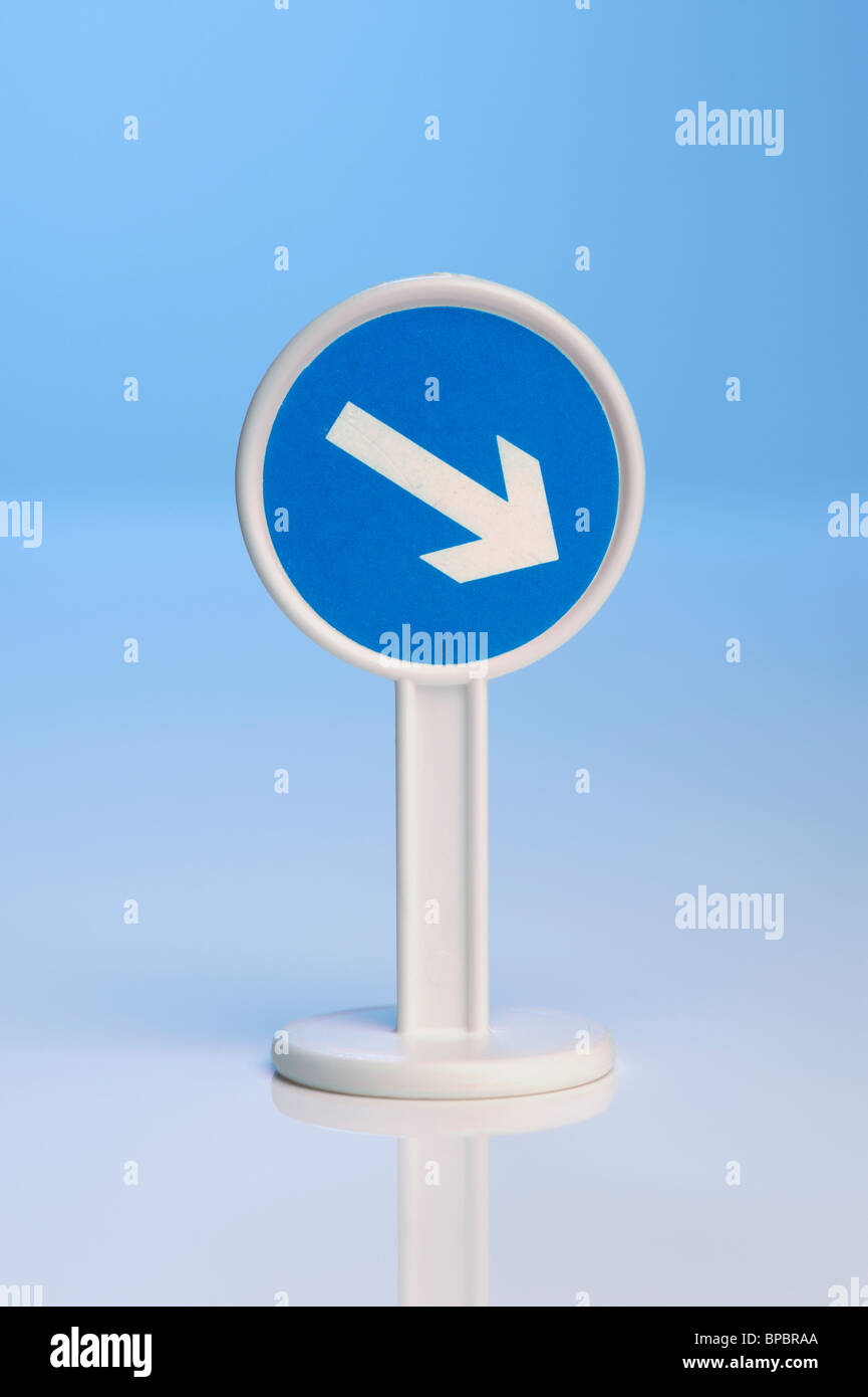 Toy blue arrow sign Stock Photo - Alamy
