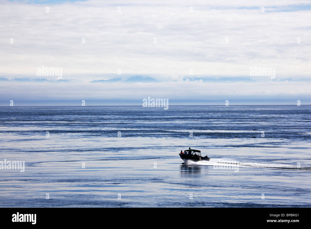 Motorboat on Puget Sound. Olympic Mountains in background. San Juan ...
