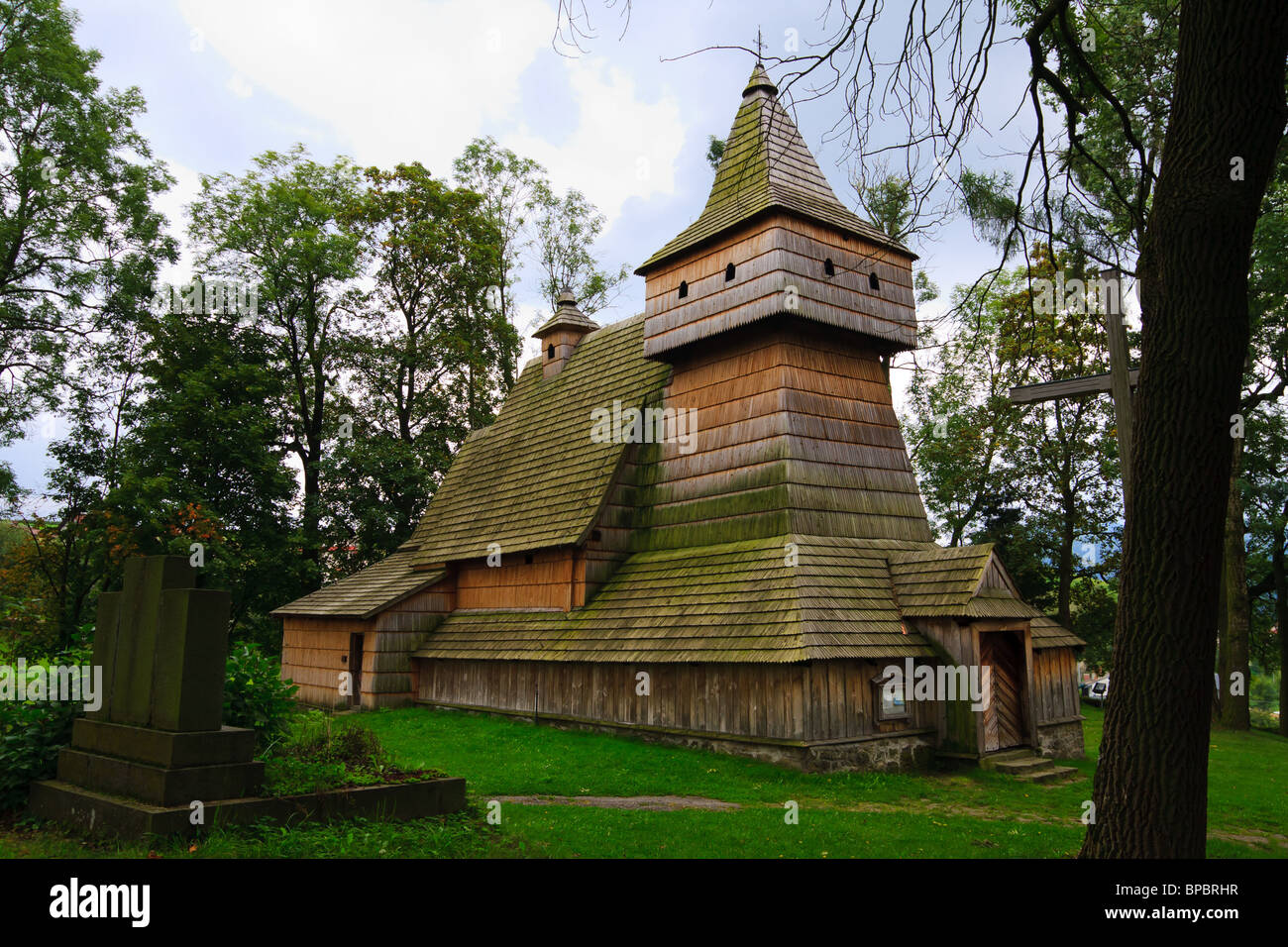 Historical wooden church in polish heritage park. Blue sky and clouds ...