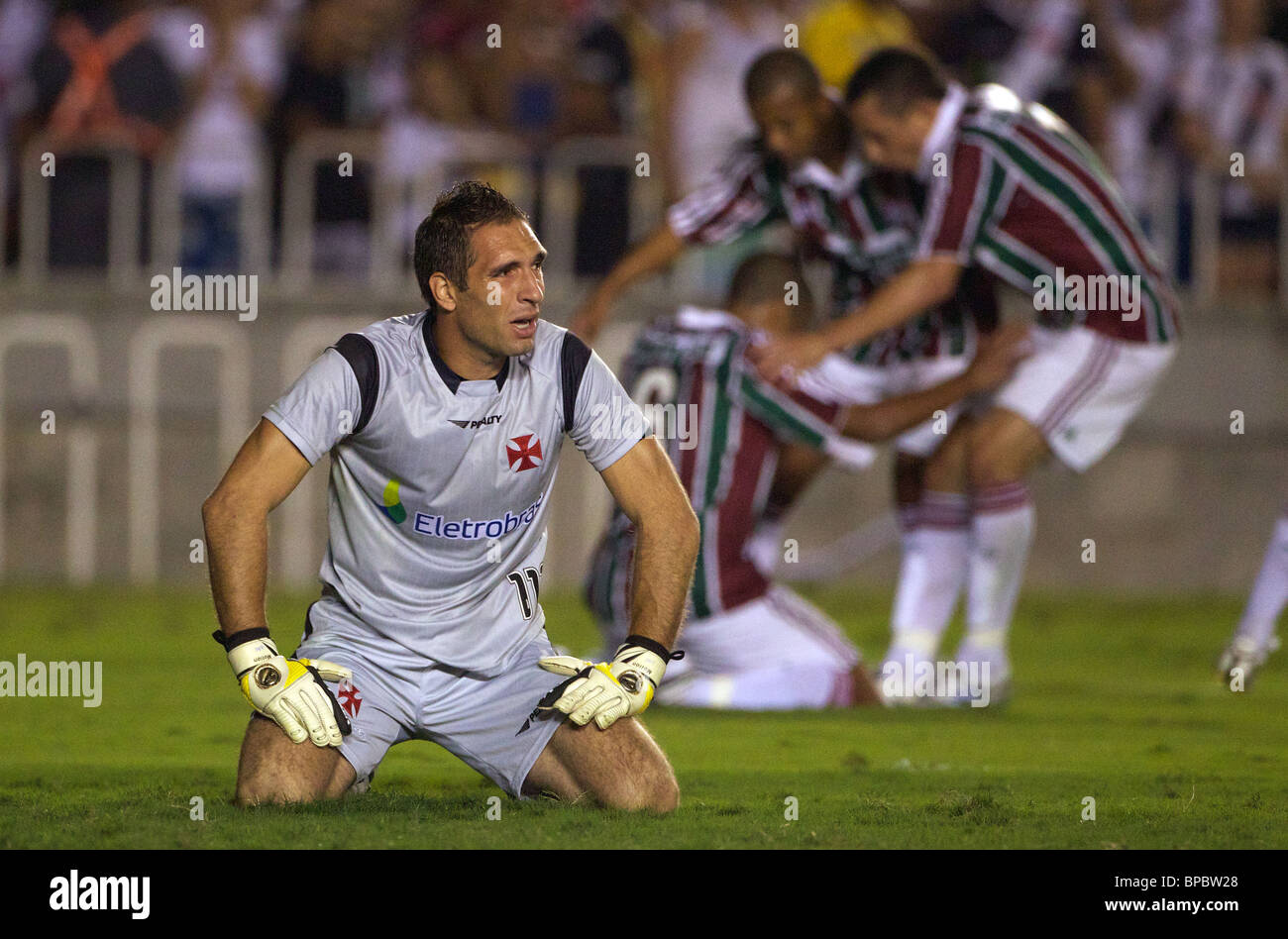 Julio Cesar (right) celebrates with team mates after scoring for ...