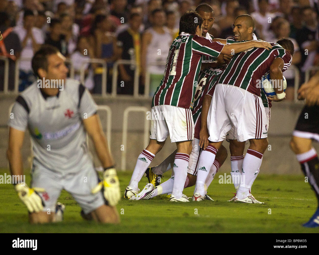 Julio Cesar (right) celebrates with team mates after scoring for ...