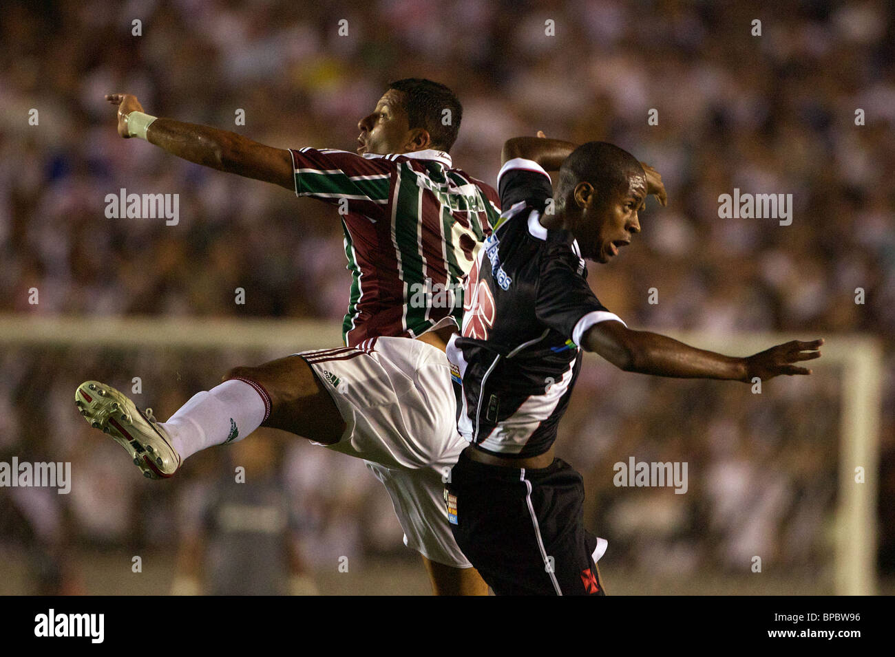 Fluminense striker Washington (left) challenges Dede of Vasco during ...