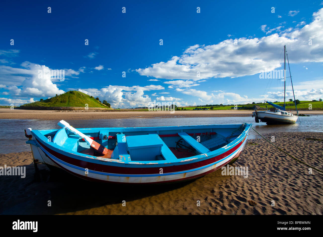 England, Northumberland, Alnmouth. Boats on the tidal Aln Estuary at ...