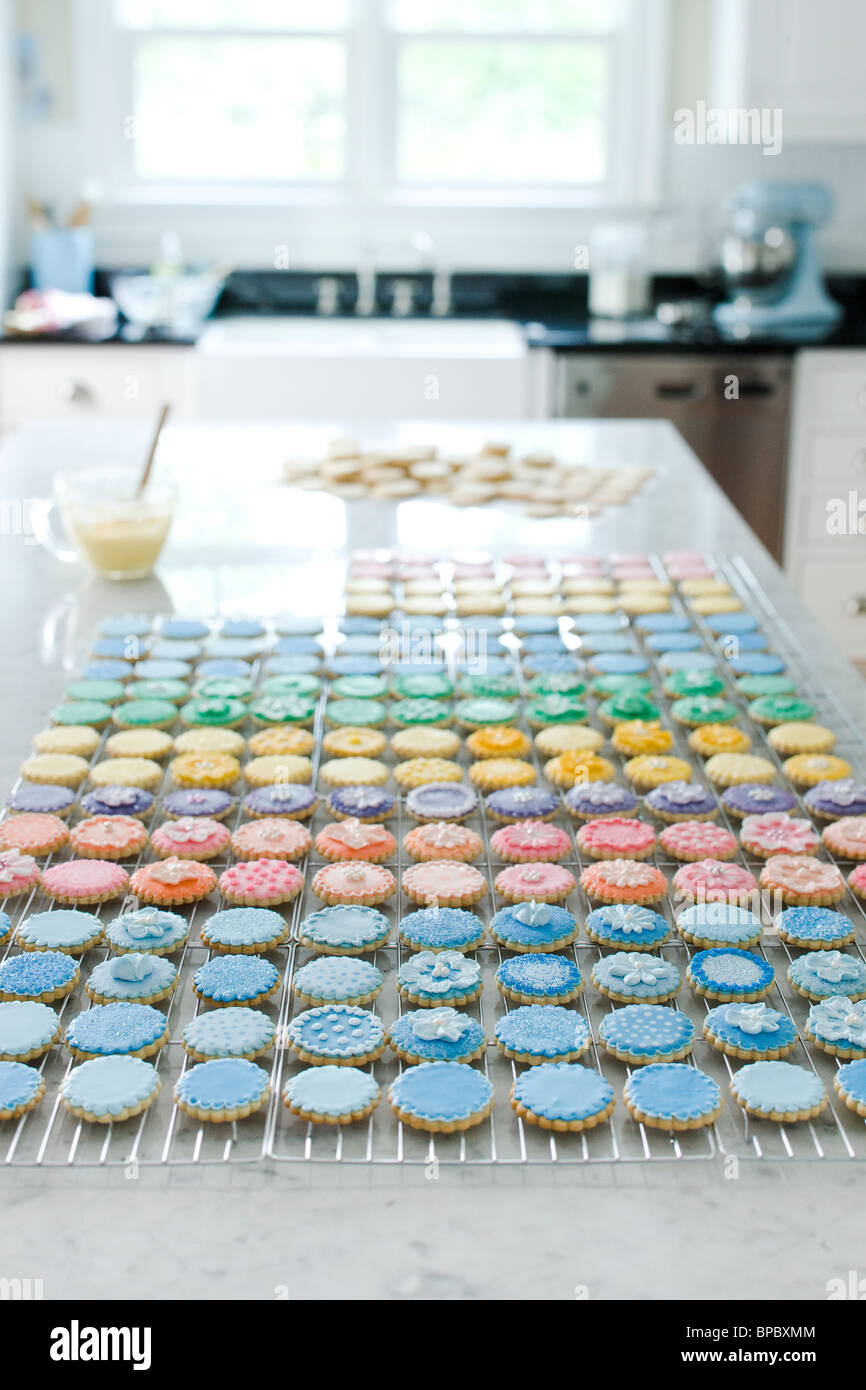 Beautiful multicolored frosted cookies in kitchen Stock Photo - Alamy