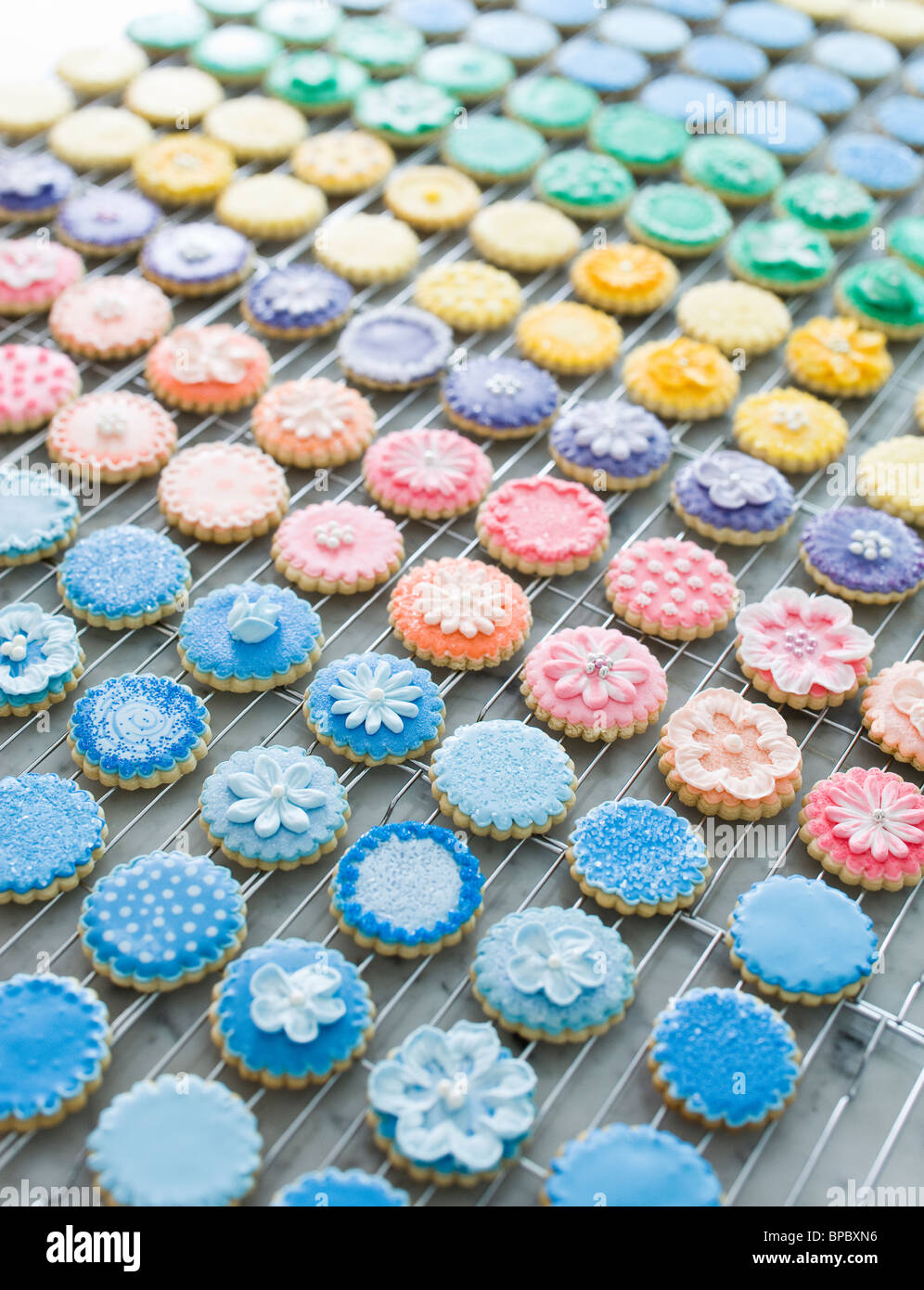 Beautiful multicolored frosted cookies in kitchen Stock Photo - Alamy