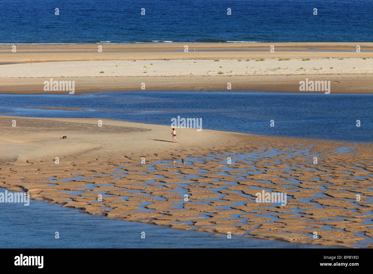 A woman enjoying the day on the sea (Ria Formosa, Algarve, south coast ...
