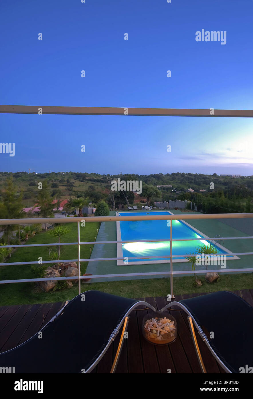 Beautiful swimmingpool with lights on at dusk Stock Photo - Alamy