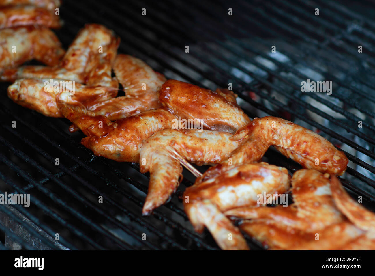 Bar-b-Que Chicken wings on a charcoal grill Stock Photo - Alamy