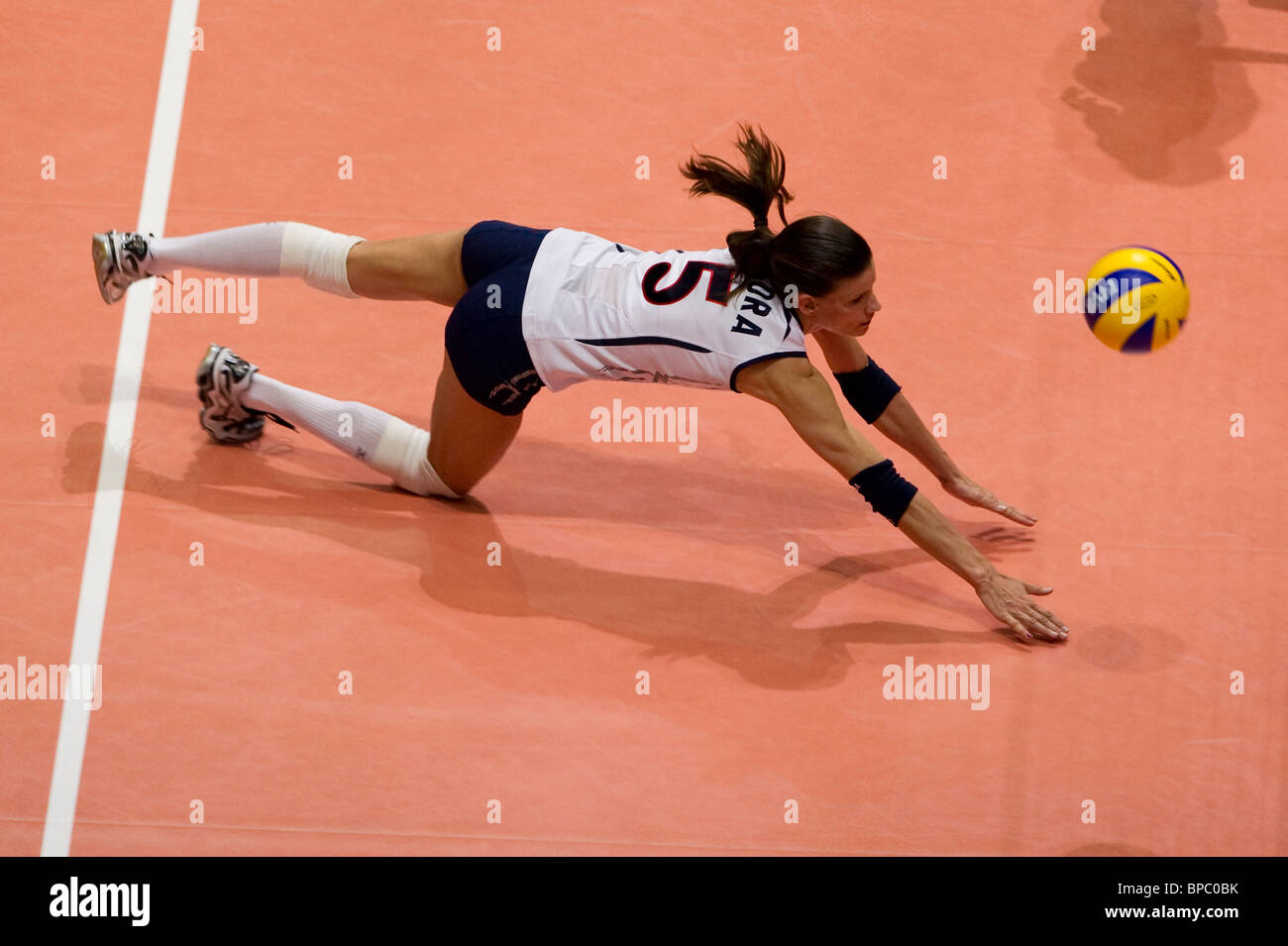 Stacy Sykora of the USA dives to save a ball against China during their ...