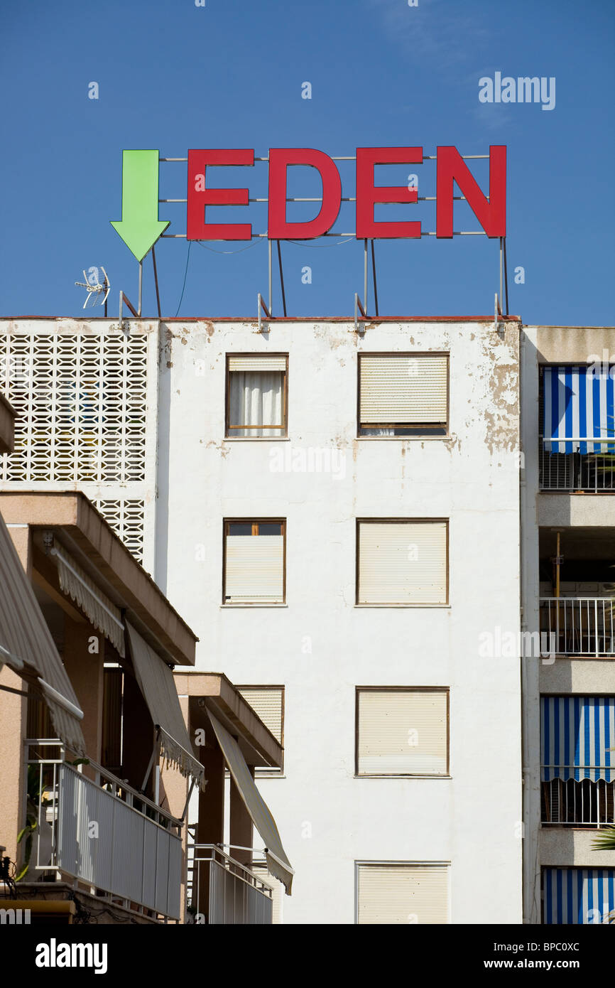 Photograph of apartment building in Spain with "Eden" sign on the roof ...