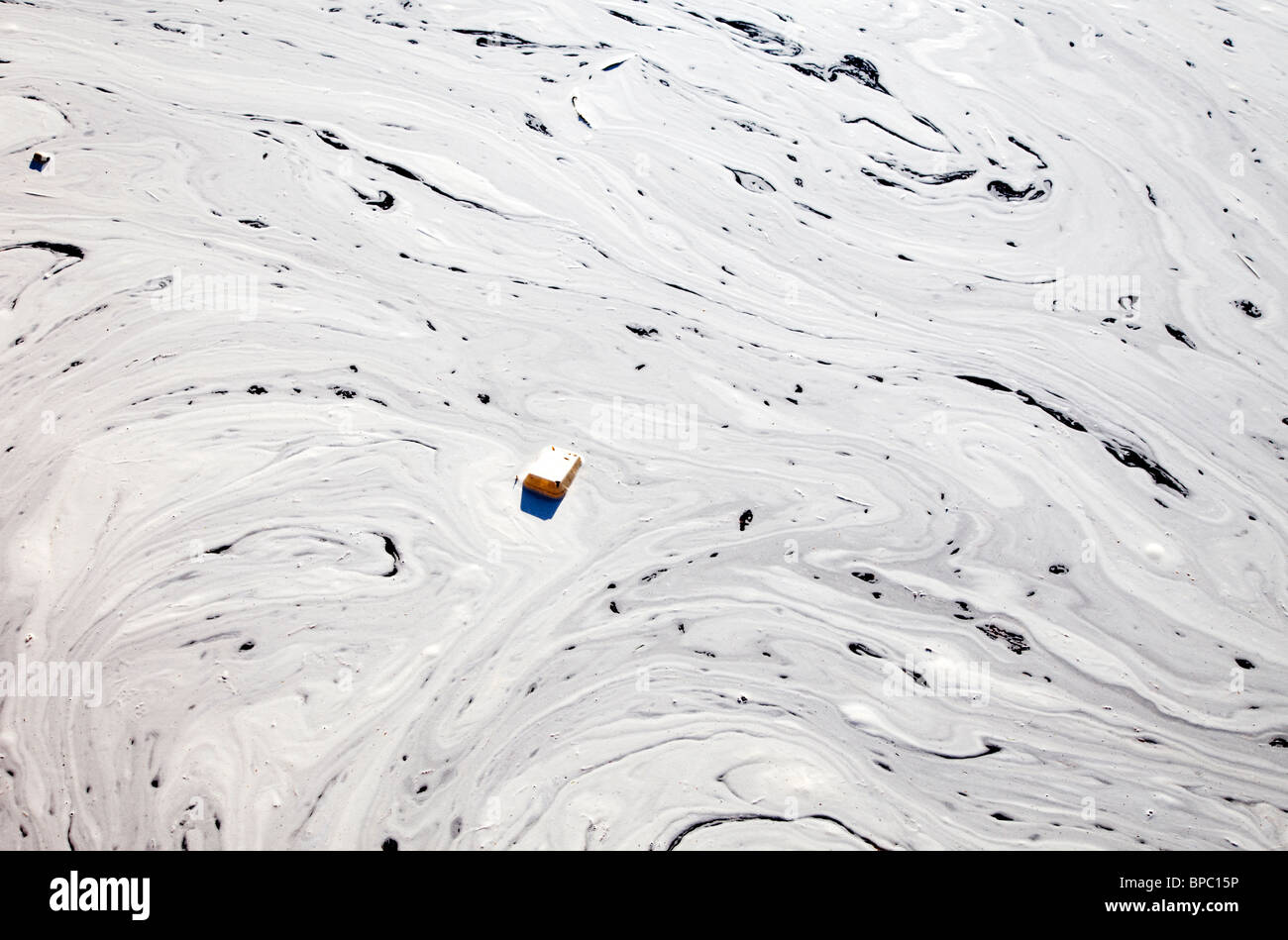 Layer of waste floating on water surface Stock Photo - Alamy