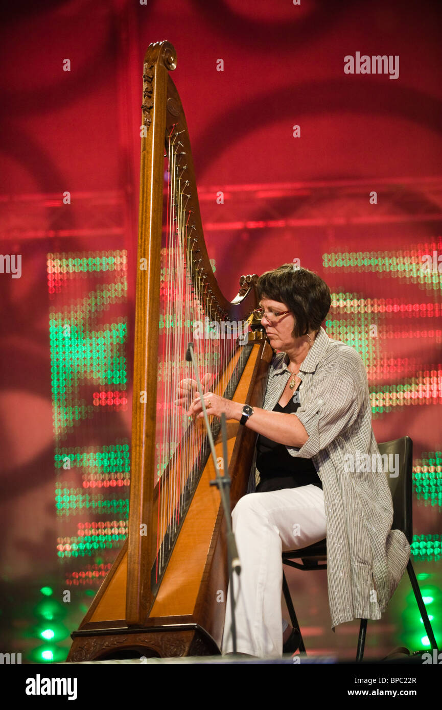 Harpist playing on stage in competition at the National Eisteddfod of ...