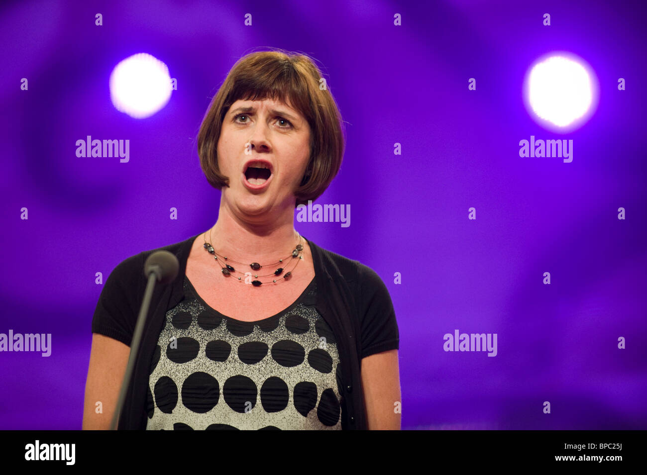 Female singer singing solo on stage in competition at the National ...