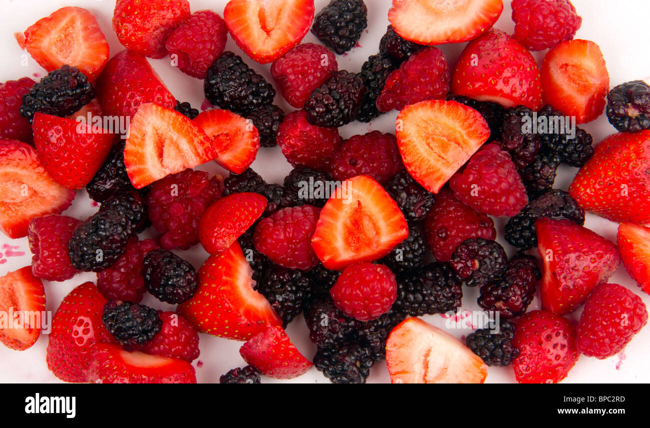 A pile of mixed berries on a white background Stock Photo - Alamy