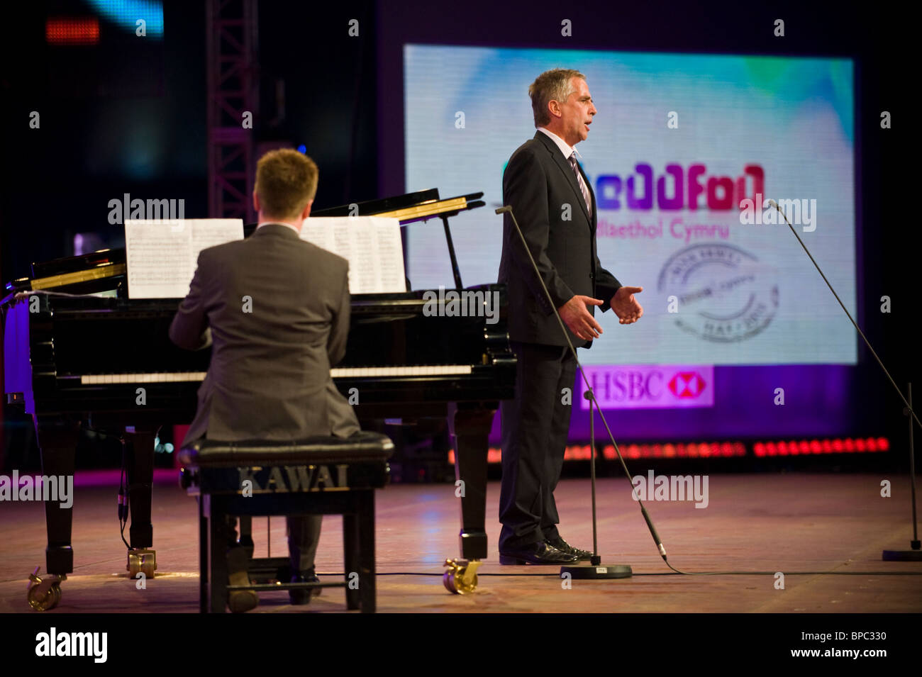 Male singer singing solo on stage in competition at the National ...