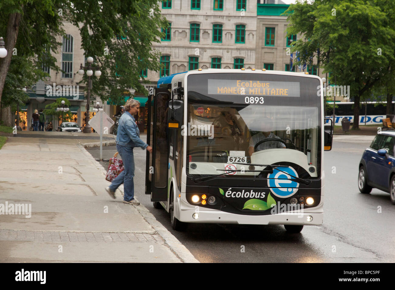 Woman boarding electric bus. Old Quebec City, Canada Stock Photo - Alamy
