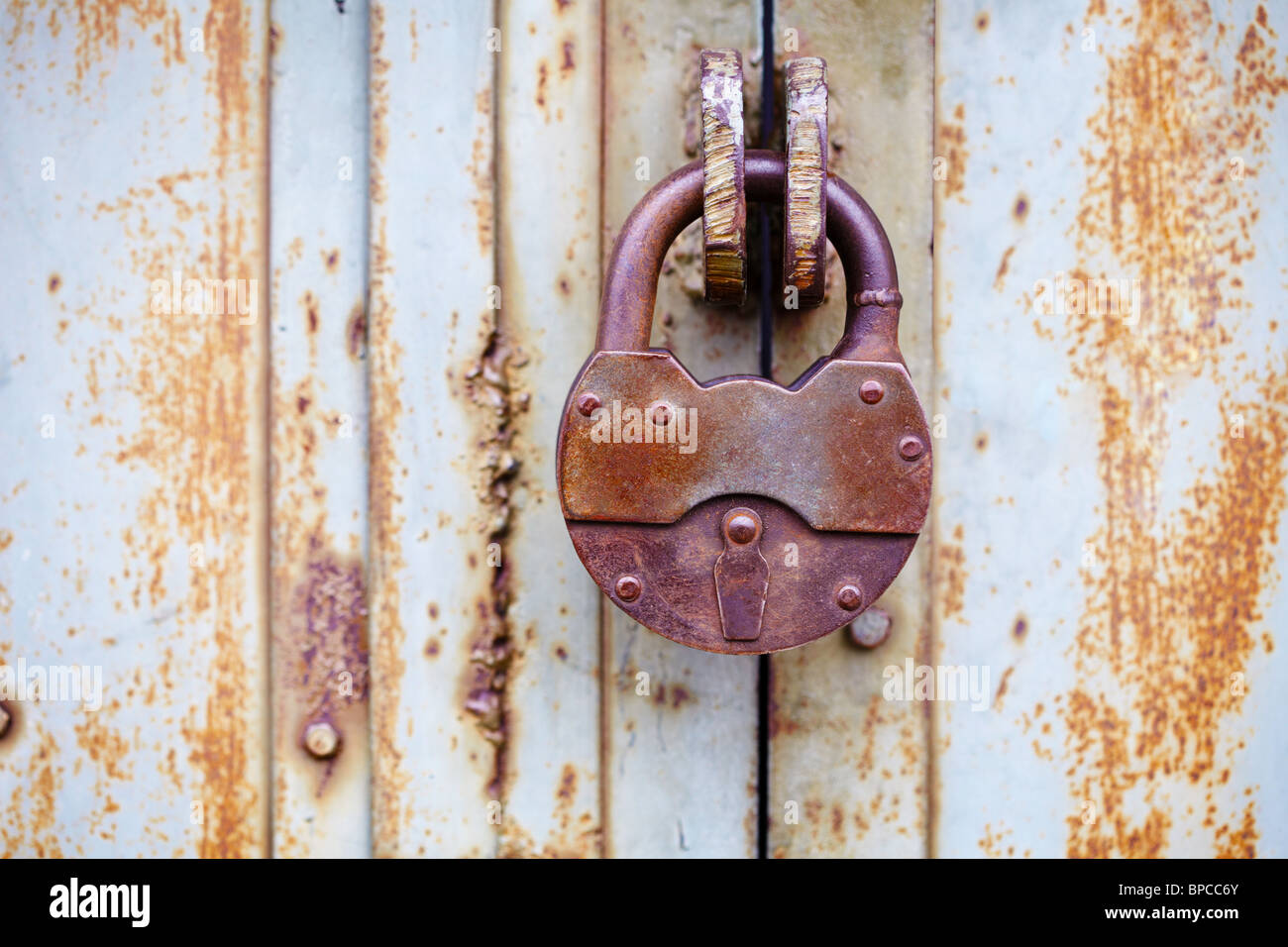 The big ancient padlock on a door Stock Photo - Alamy