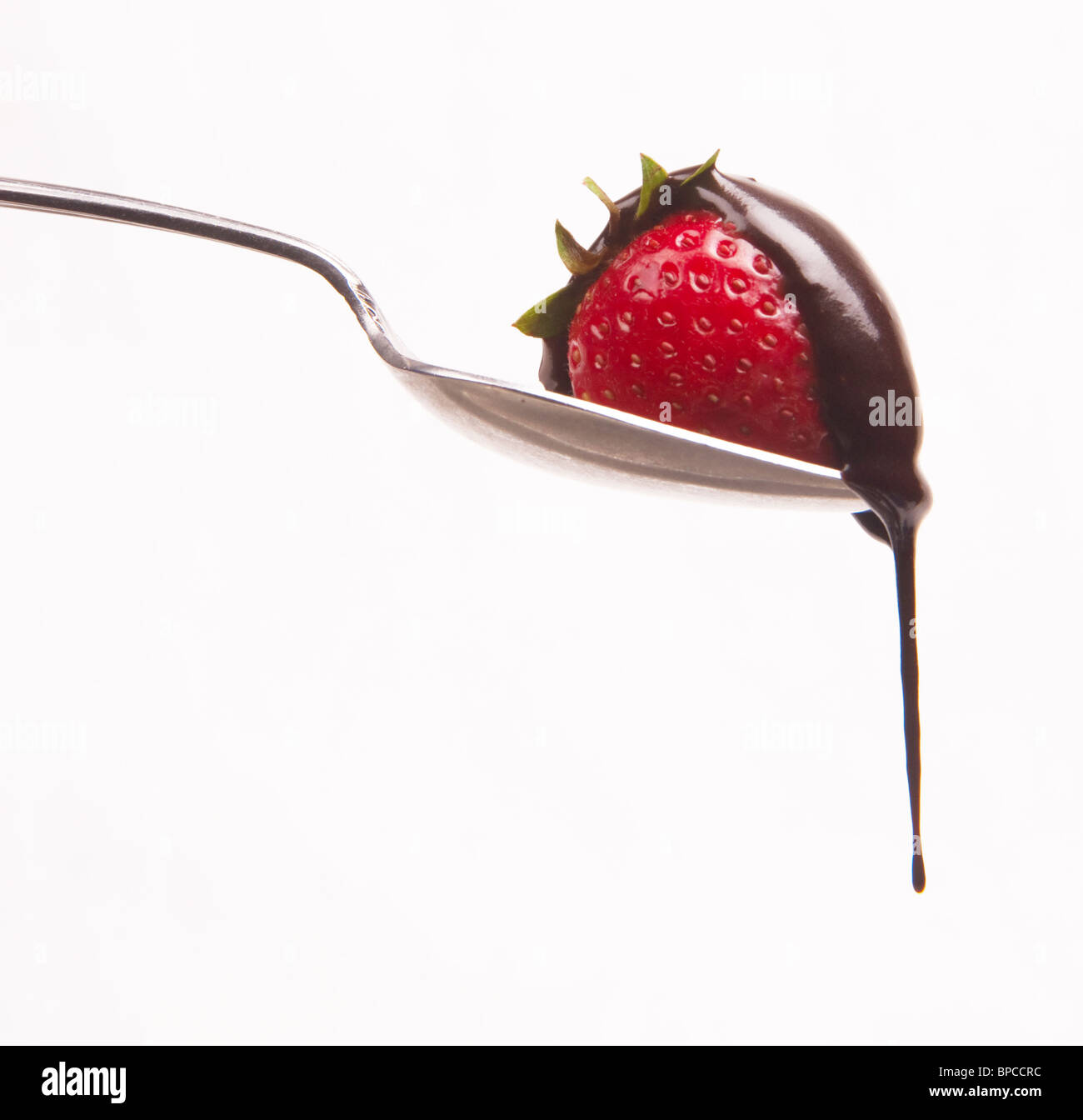 Chocolate dripping spoon Cut Out Stock Images & Pictures - Alamy