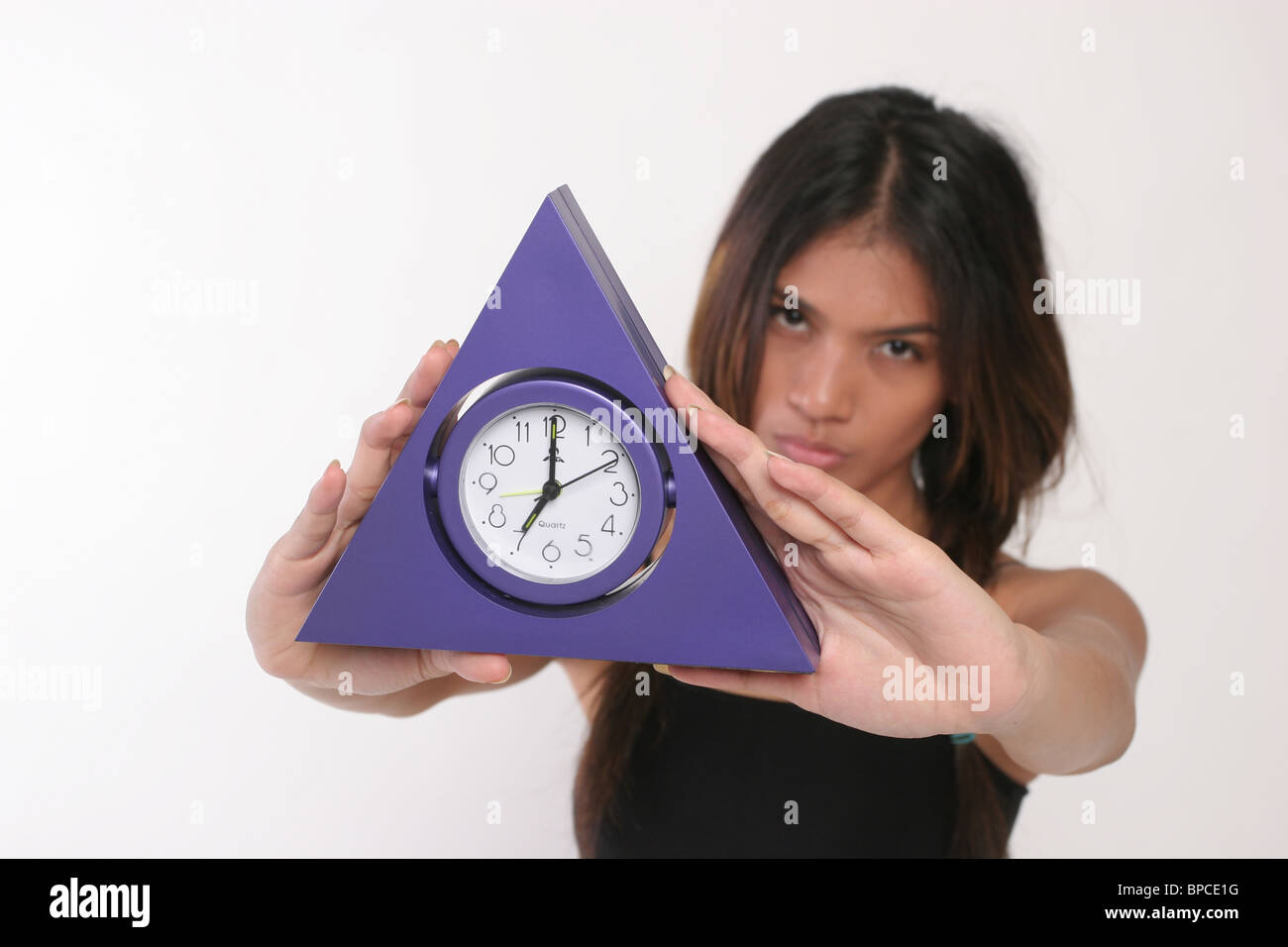 girl show triangle clock watch Stock Photo - Alamy