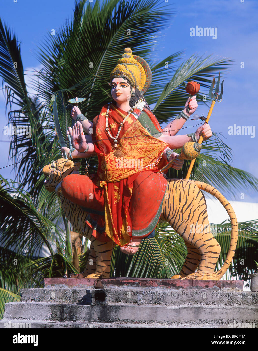 Roadside 'Goddess Durga riding a tiger' Hindu statue, Pereybere ...