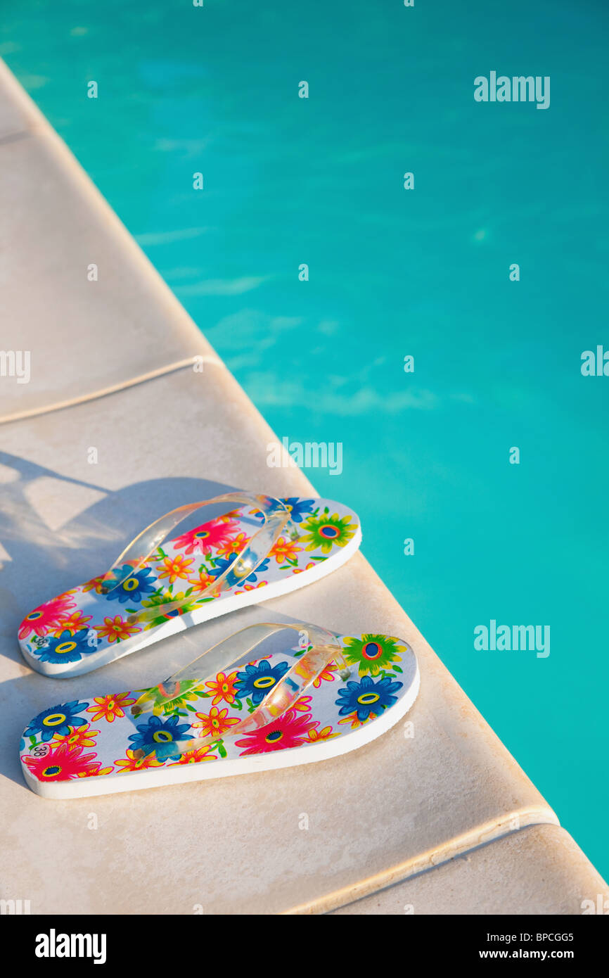 flip-flop near swimming-pool in morning sun Stock Photo - Alamy