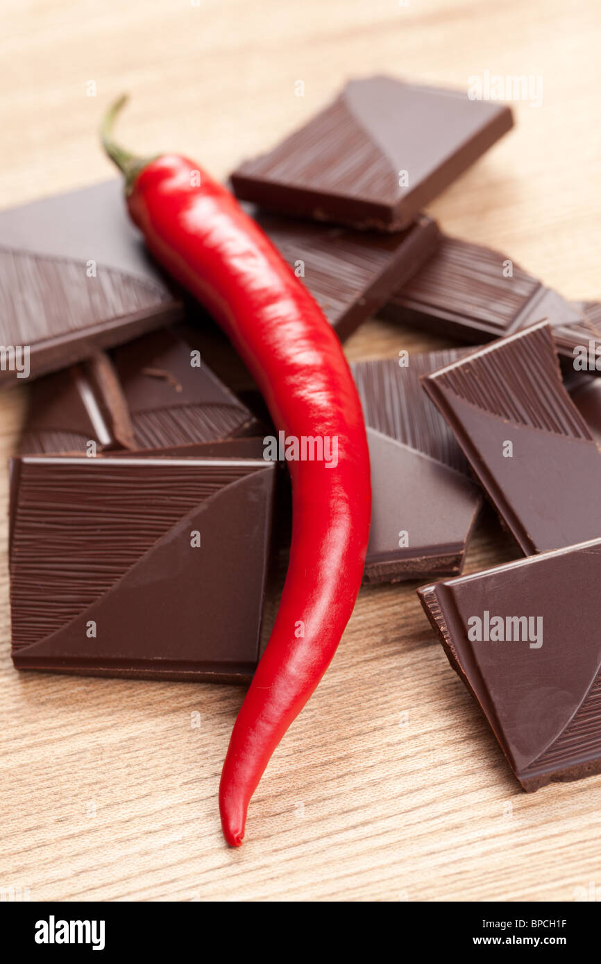 the dark chili chocolate on wooden table Stock Photo - Alamy